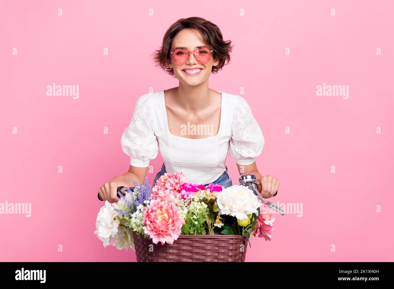 Photo of excited pretty girl dressed white top heart eyewear riding ...