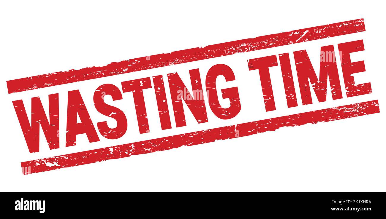 WASTING TIME text written on red rectangle stamp sign Stock Photo - Alamy