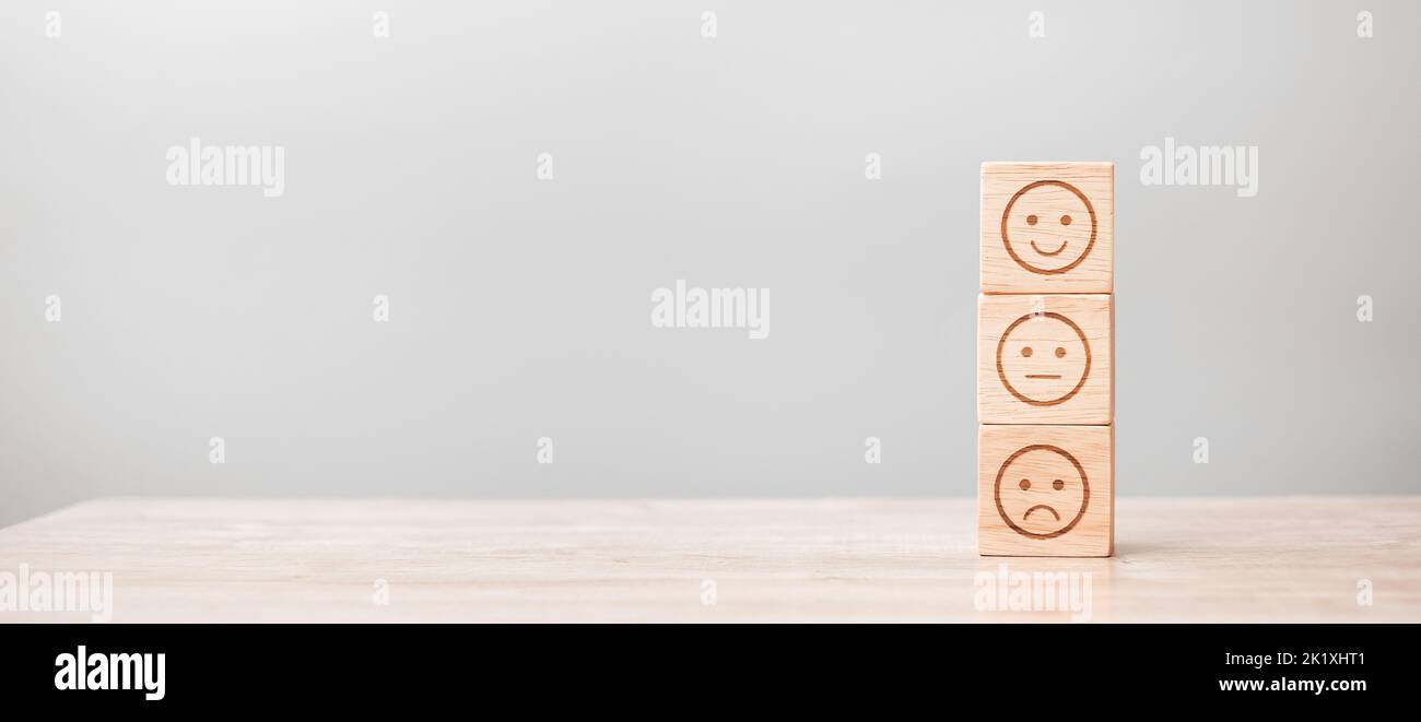 emotion face symbol on wooden blocks. Service rating, ranking, customer ...