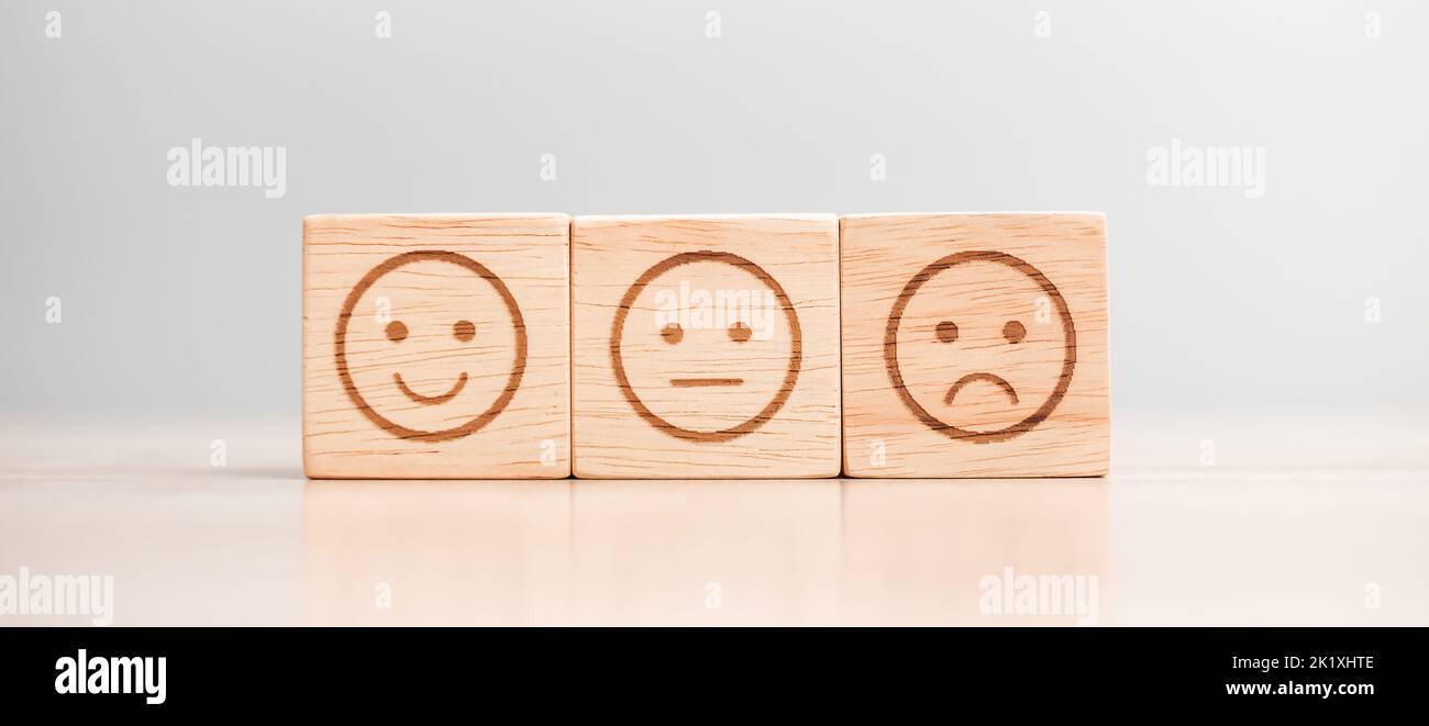 emotion face symbol on wooden blocks. Service rating, ranking, customer ...