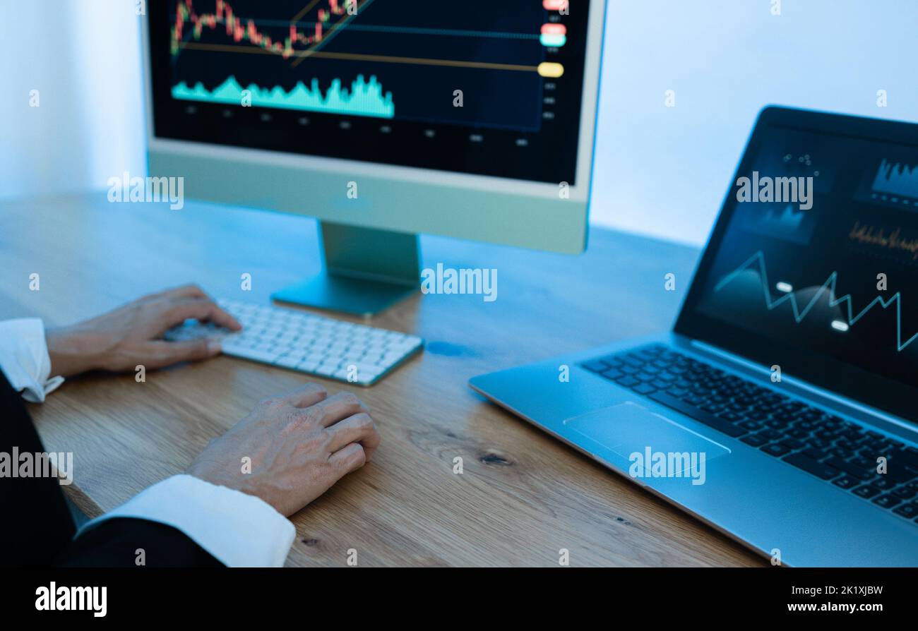 Trader woman studying stock market at home - Focus on right hand Stock ...