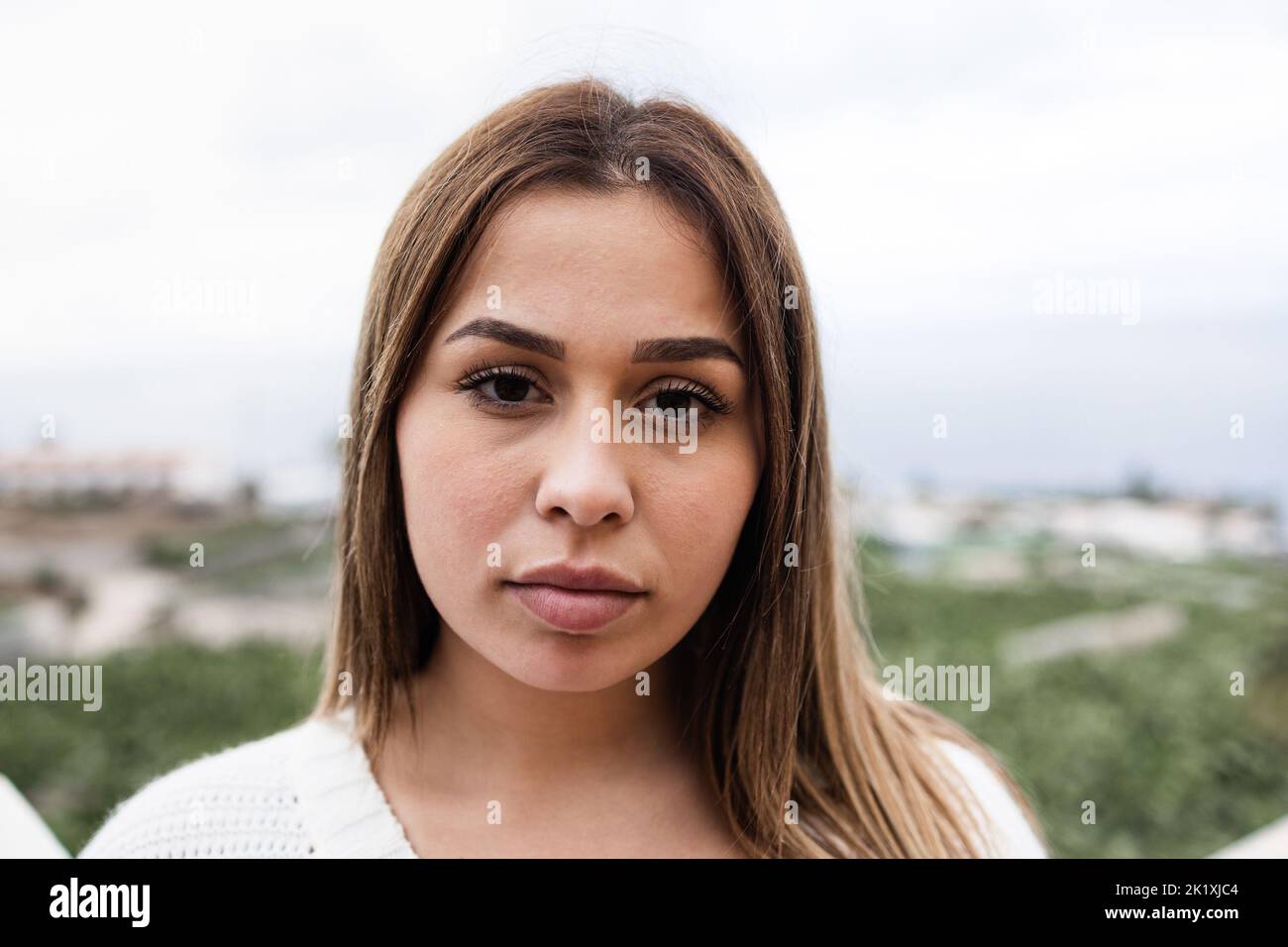 Young hispanic girl looking at camera outdoor - Focus on face Stock ...