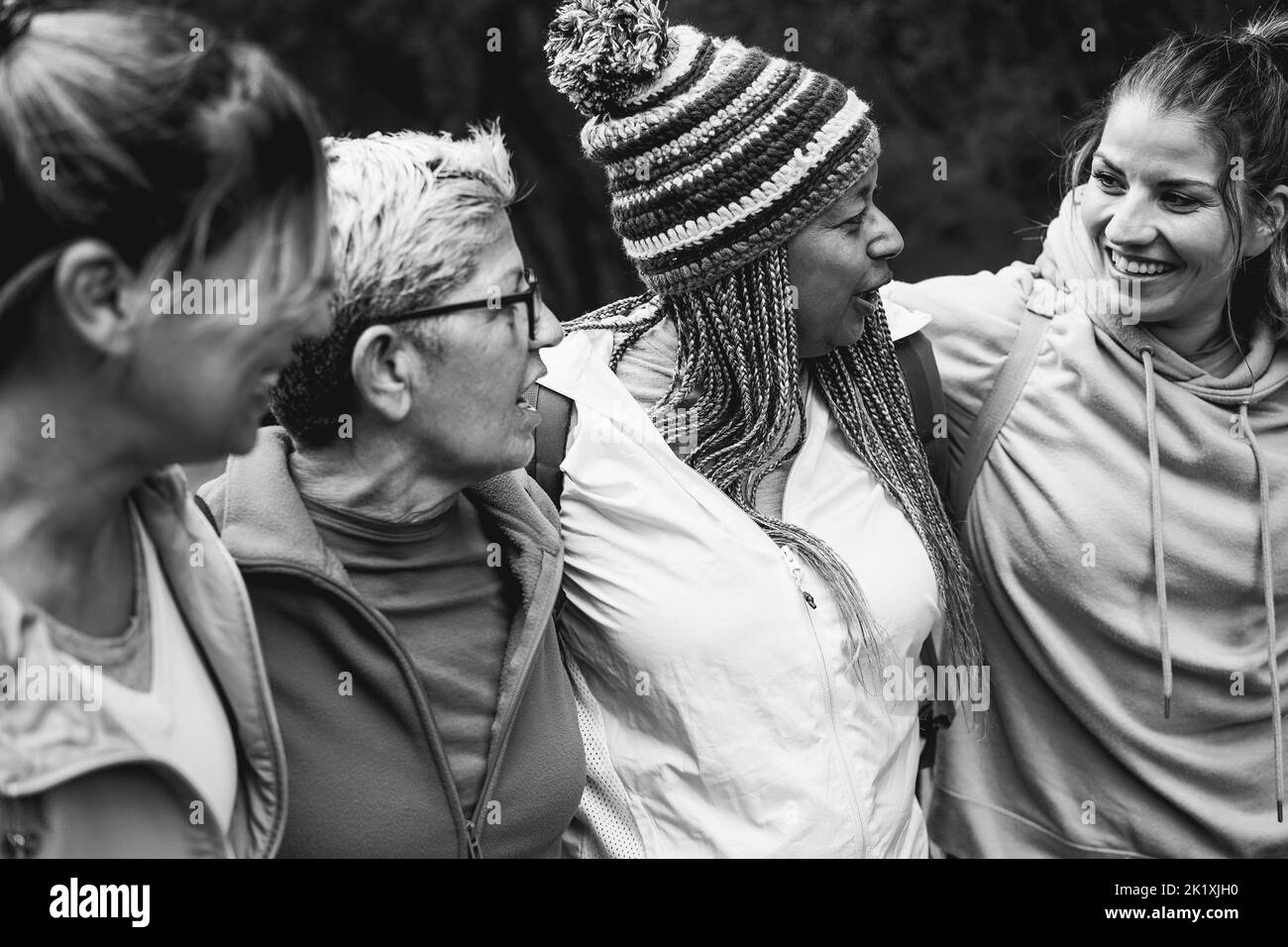 Multiracial women having fun during trekking day in mountain forest ...