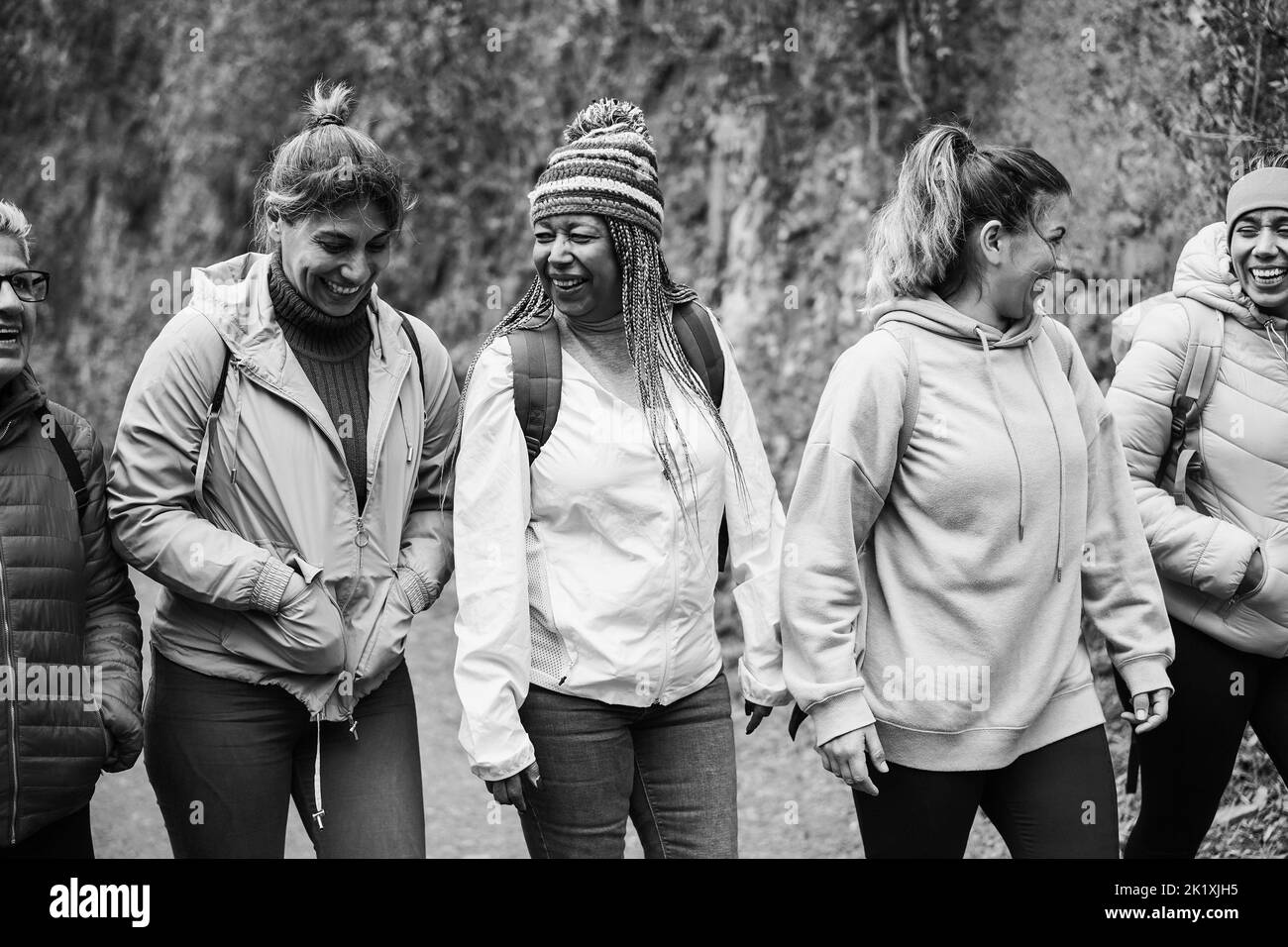 Multiracial women having fun during trekking day in mountain forest ...