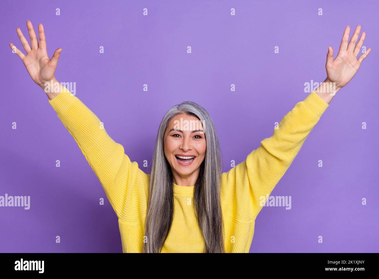 Photo of sweet excited lady pensioner dressed pullover rising arms ...