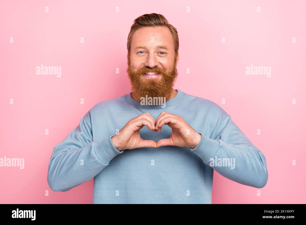 Photo of optimistic handsome positive man with ginger beard dressed ...