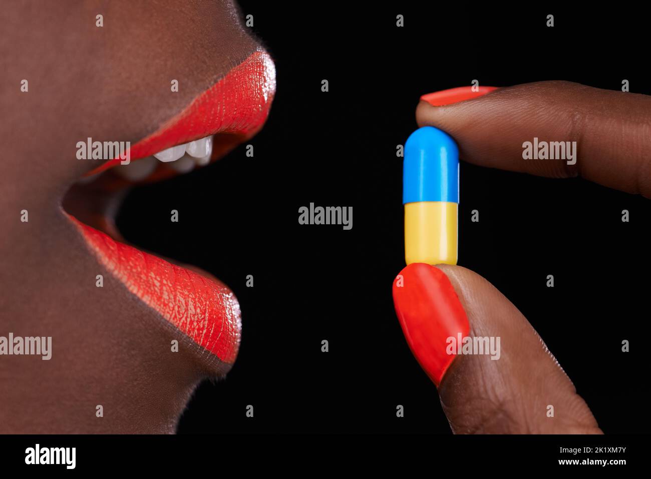 Addicted to color. Cropped view of an african woman with bright red ...