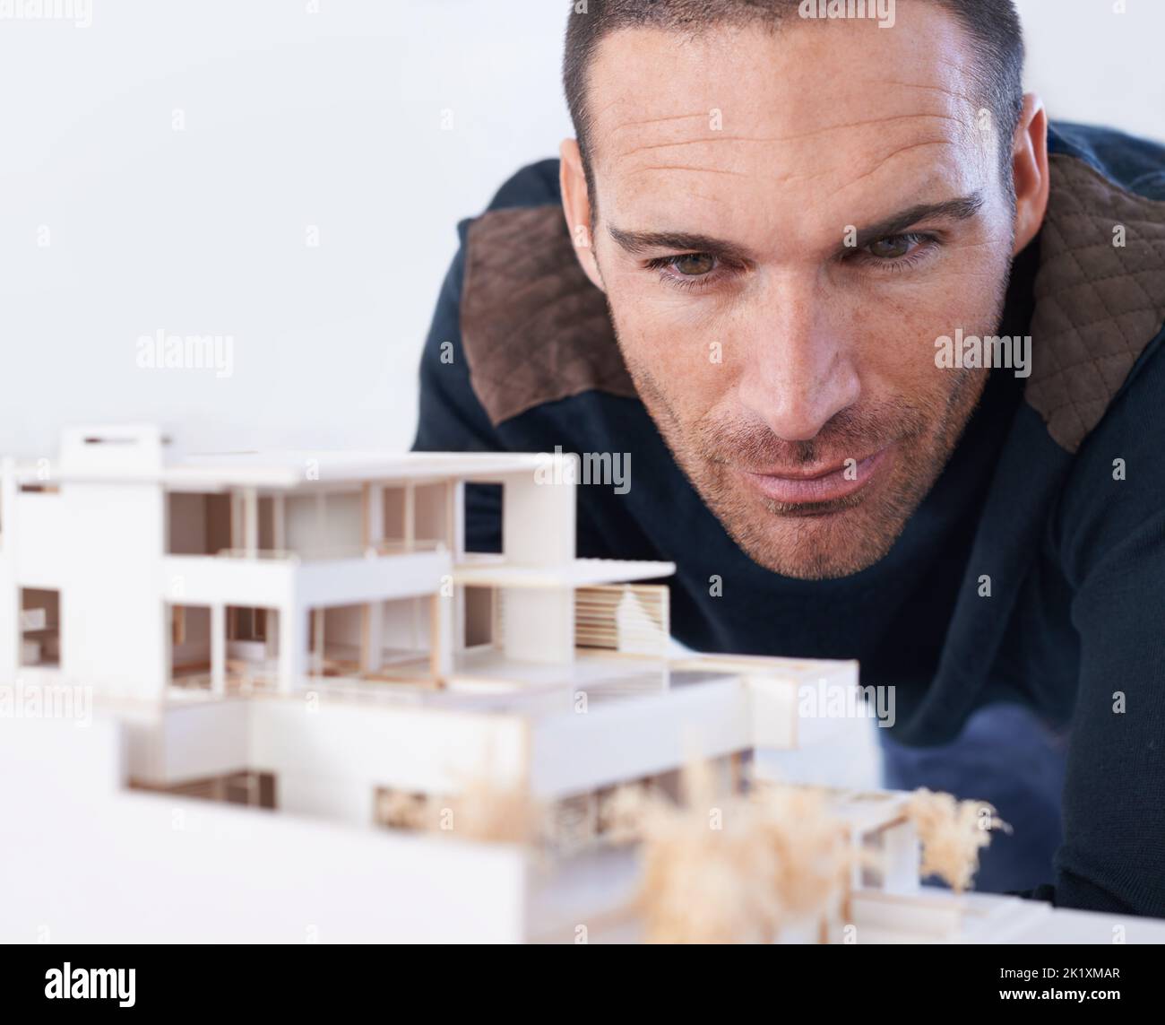 Making sure that every detail is perfect. Close-up of a male architect ...
