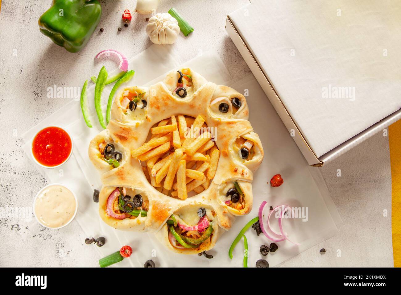 Chicken fajita stuffed bread naan with potato chips fries in a delivery ...