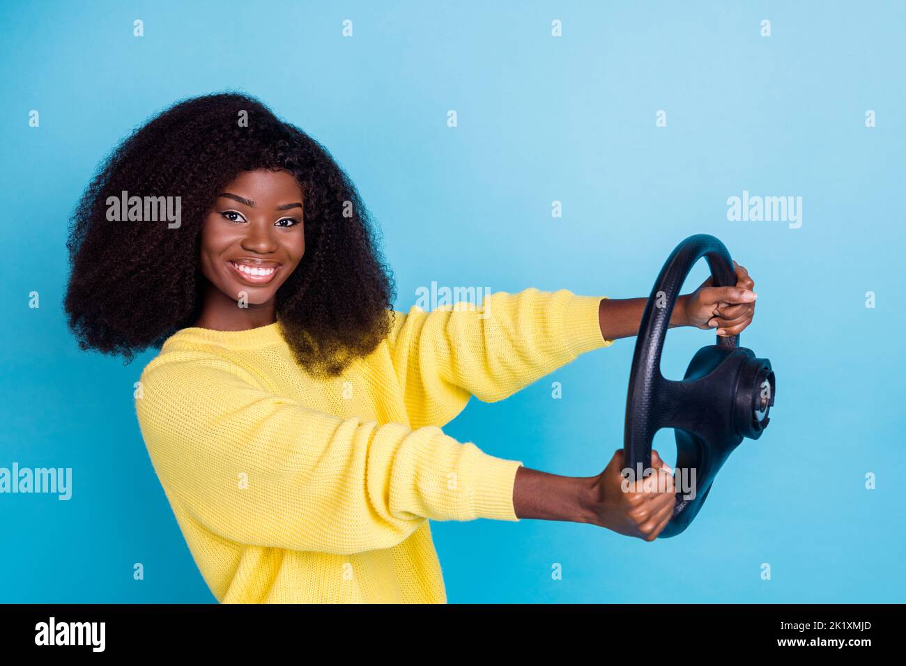 Side profile photo of young driver girl hold steering wheel looking you ...