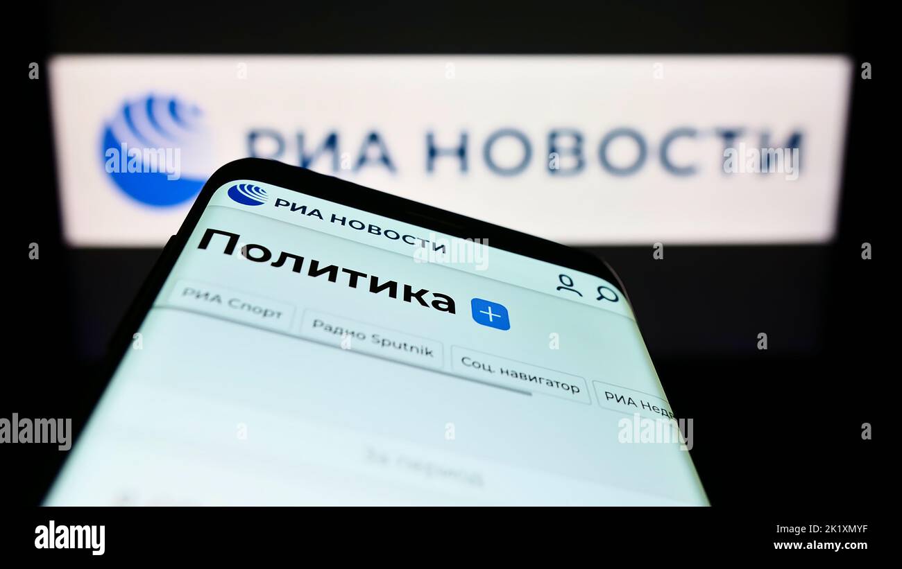 Mobile phone with webpage of Russian state-owned news agency RIA ...