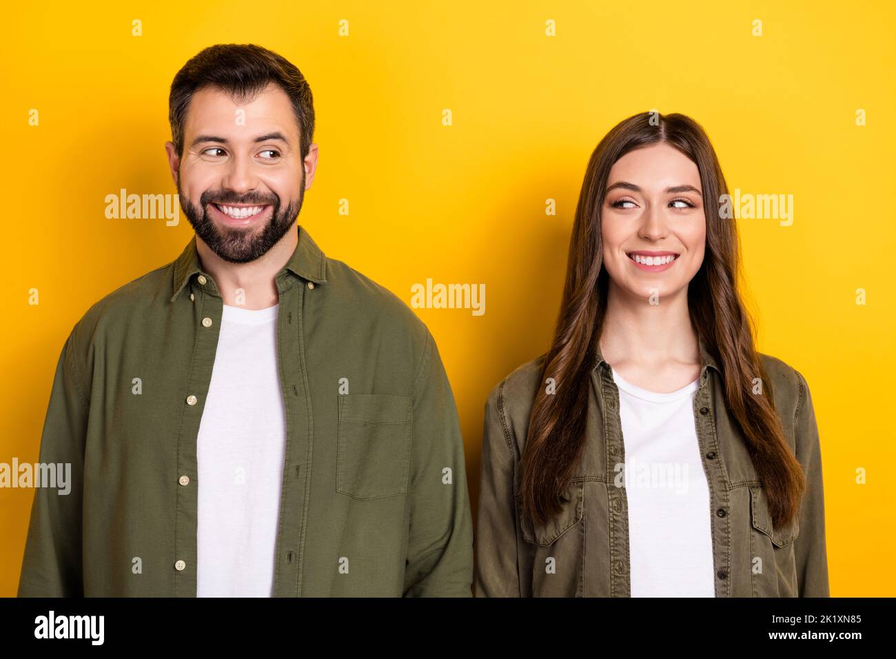 Portrait of positive friendly people toothy smile look each other ...