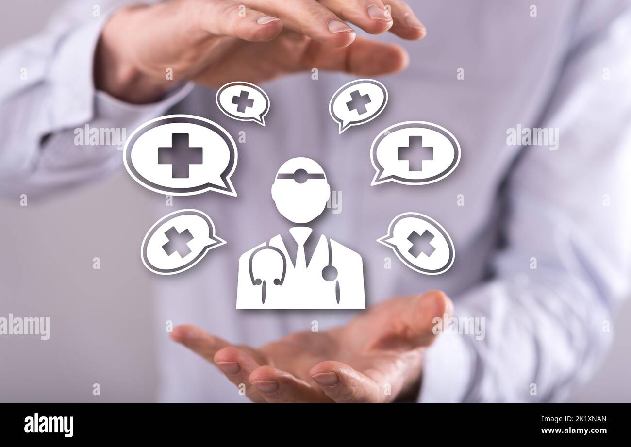 Medical assistance concept between hands of a man in background Stock ...