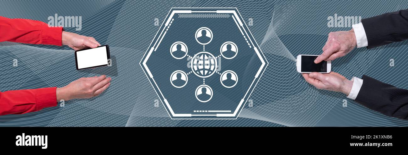 Top view of hands using mobile phone with symbol of globalization ...