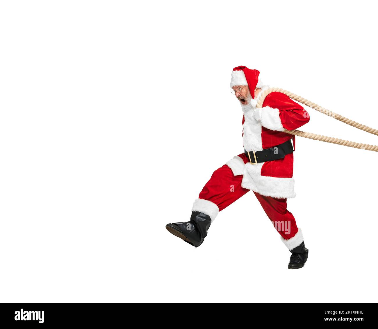 Portrait of emotive senior man in image of Santa Claus pulling ...