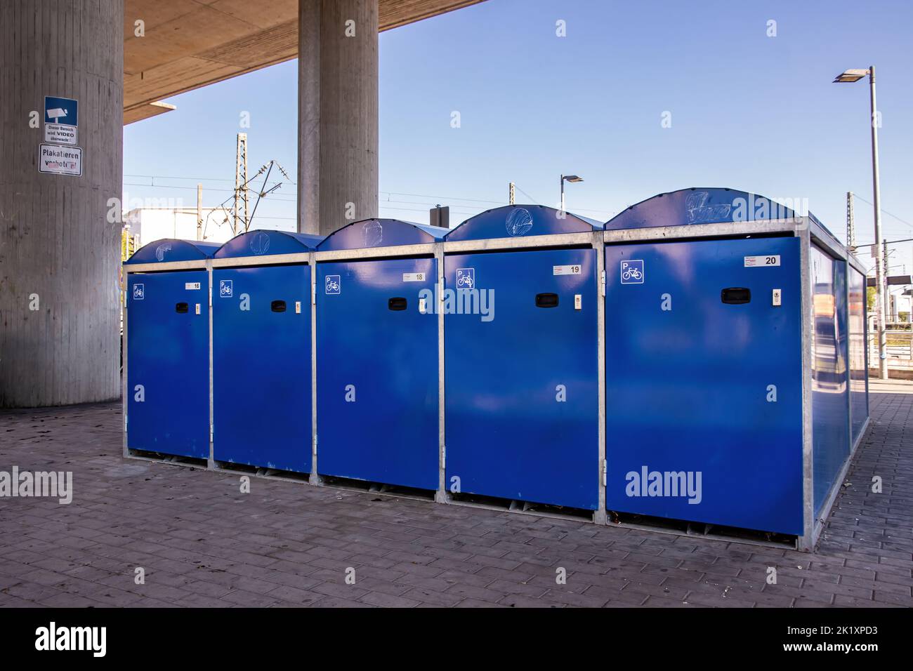 Lockable bike box on a railway station Stock Photo - Alamy