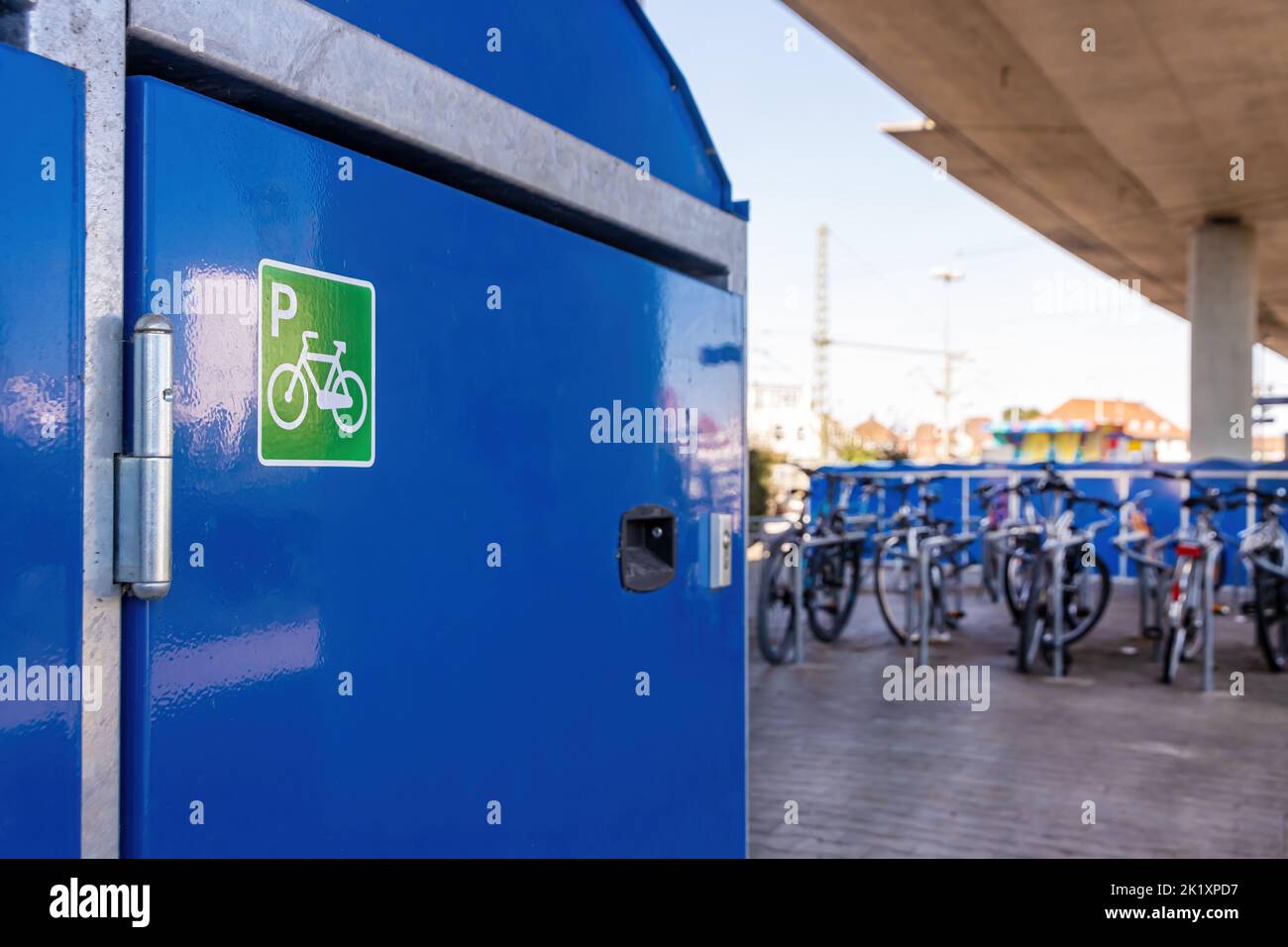 Lockable bike box on a railway station Stock Photo - Alamy
