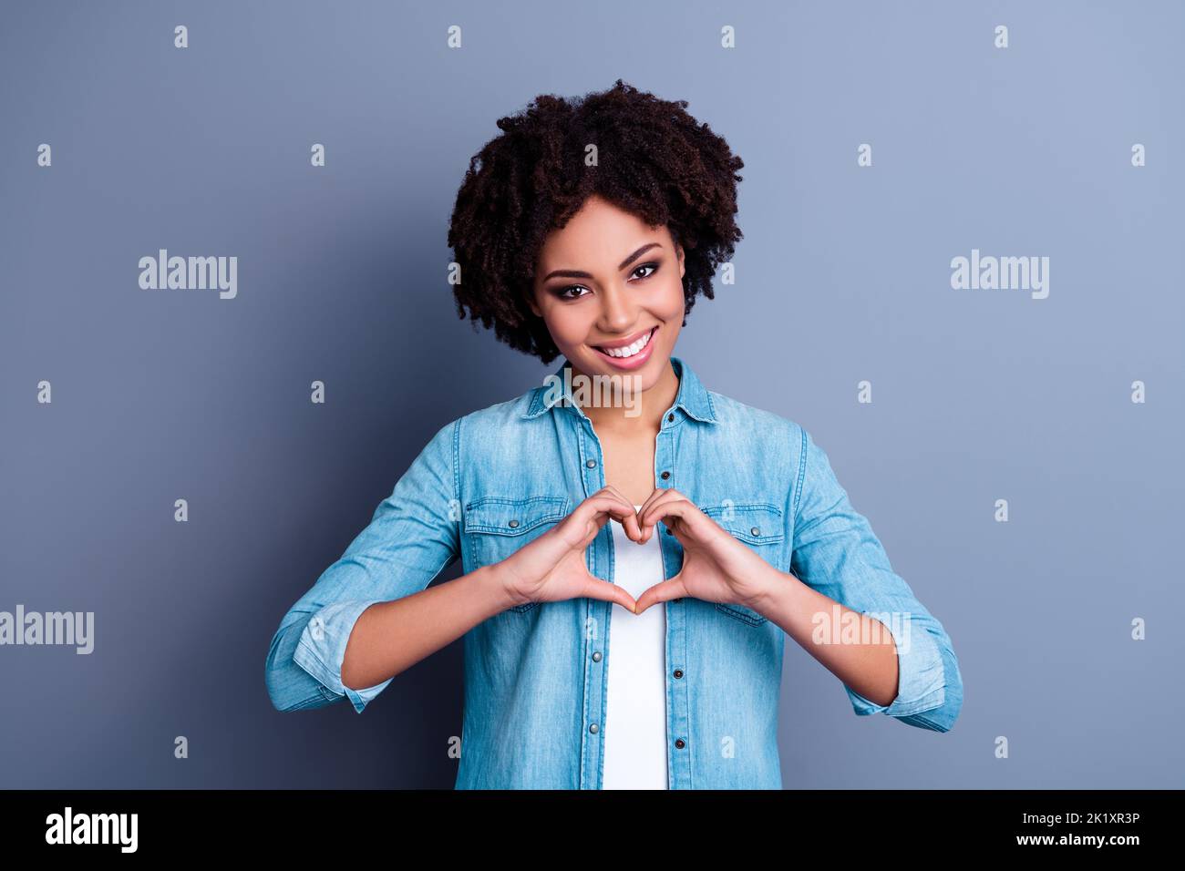 Photo of lovely adorable lady hands fingers showing heart symbol ...
