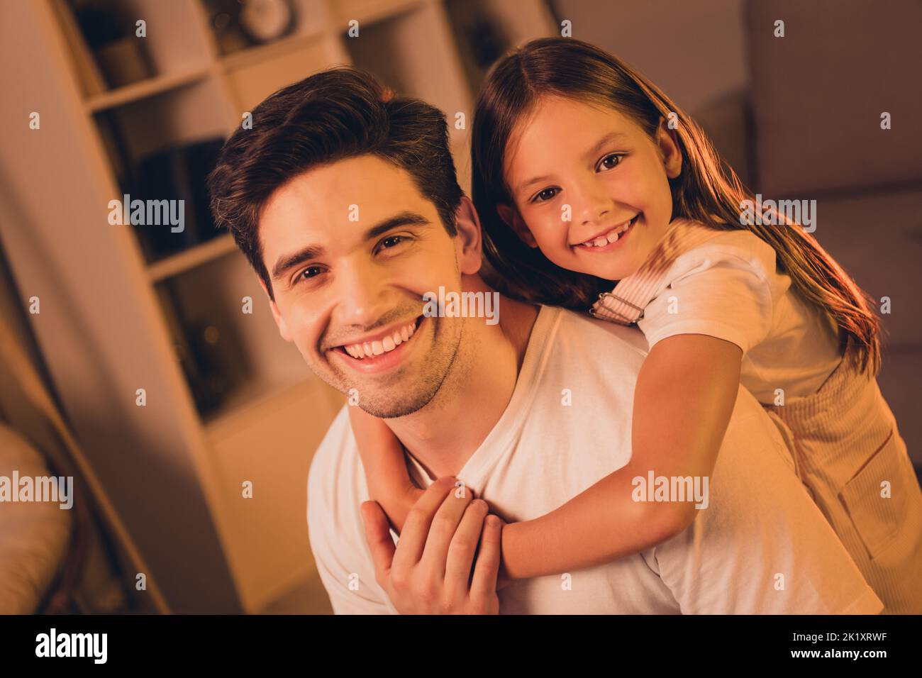 Photo of cheerful positive dad little preteen kid having fun together ...