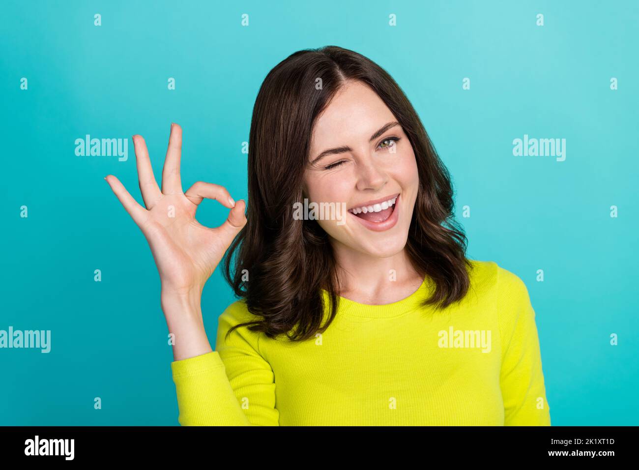 Closeup photo of young attractive cute girl blink eye smiling showing ...