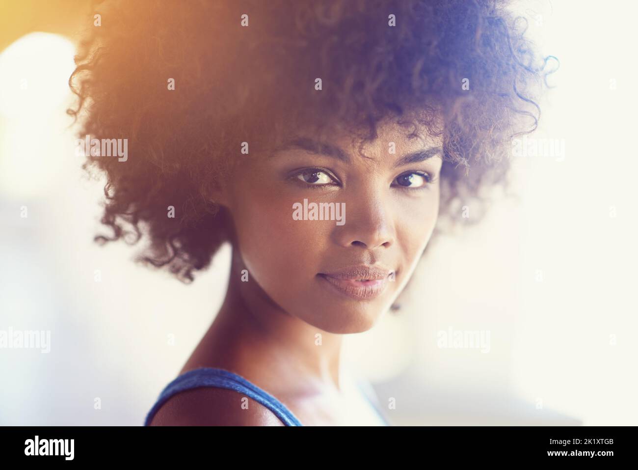 Confident woman dark curly hair hi-res stock photography and images - Alamy