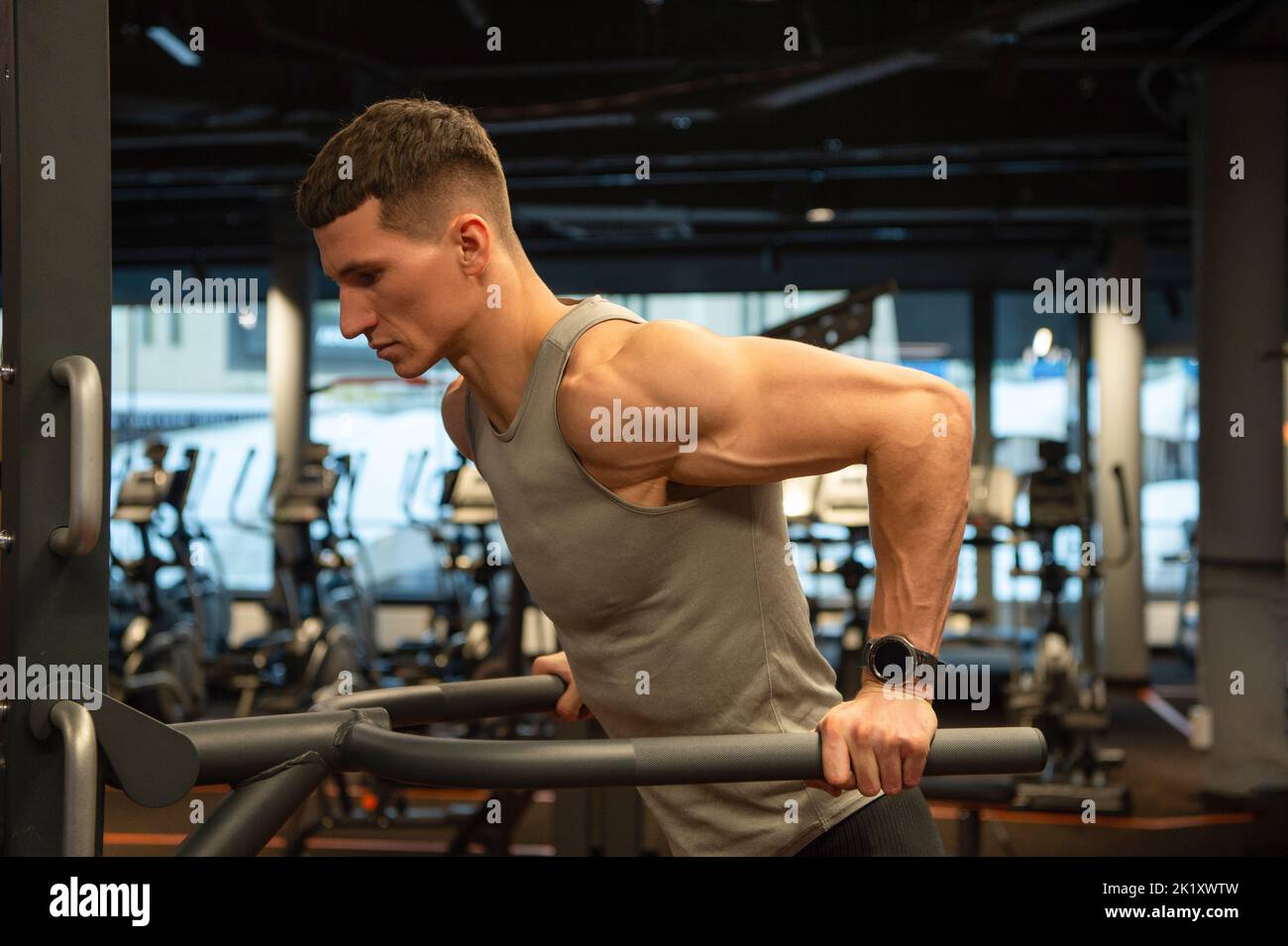 sport muscular man do pushups in fitness gym. pushups practicing ...