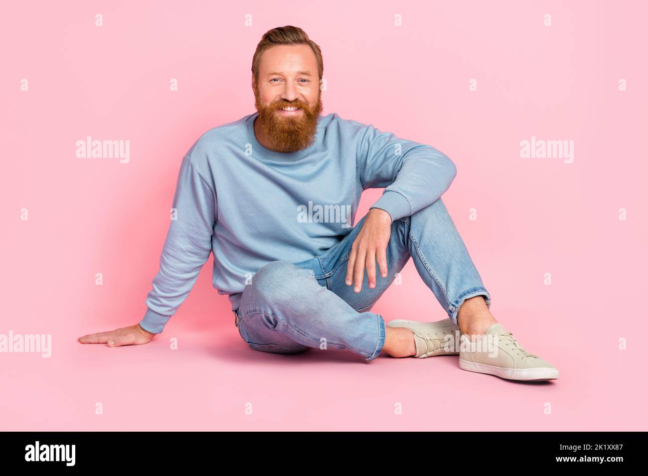 Full size photo of satisfied glad person sit floor toothy smile ...
