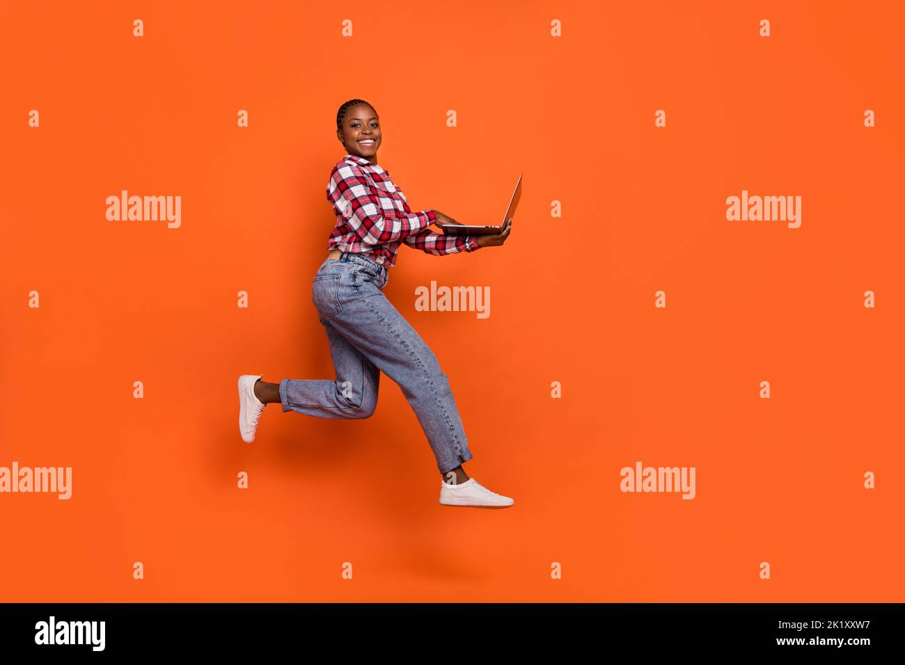 Full size photo of active sporty lady jump rush use wireless netbook ...