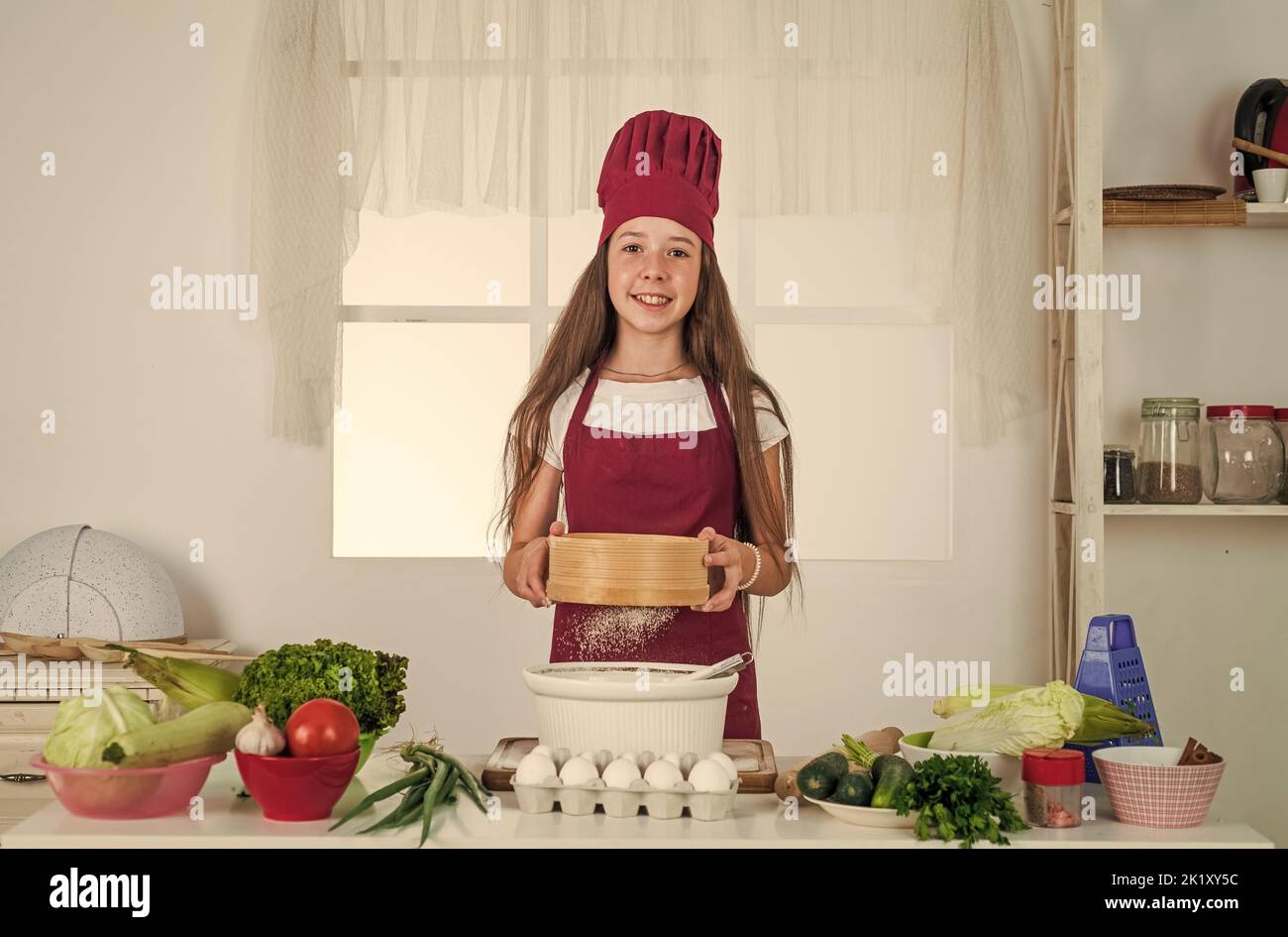 teen girl in cook uniform prepare food in kitchen, culinary Stock Photo ...