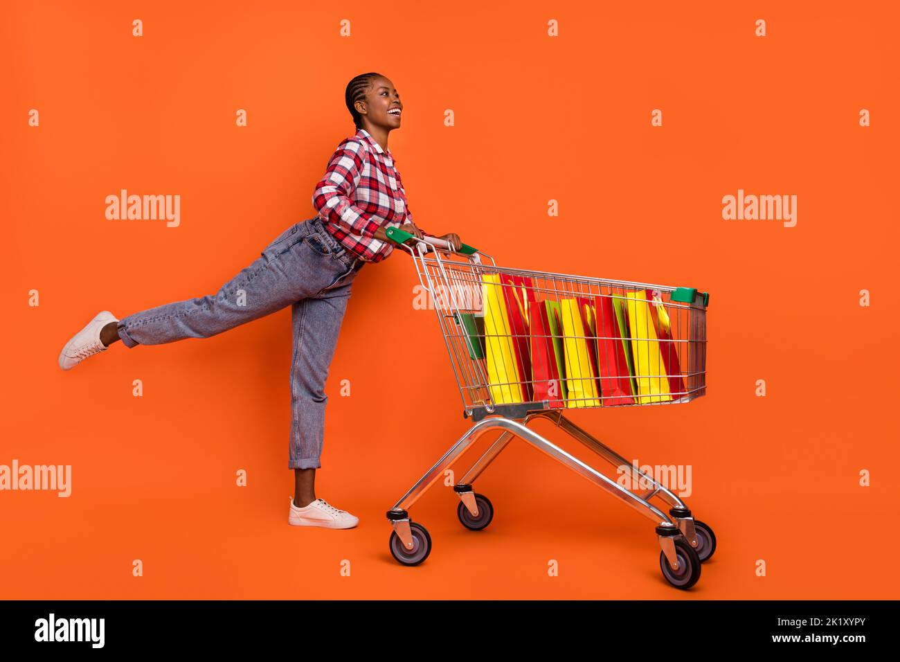 Full length photo of excited positive girl push cart look empty space ...