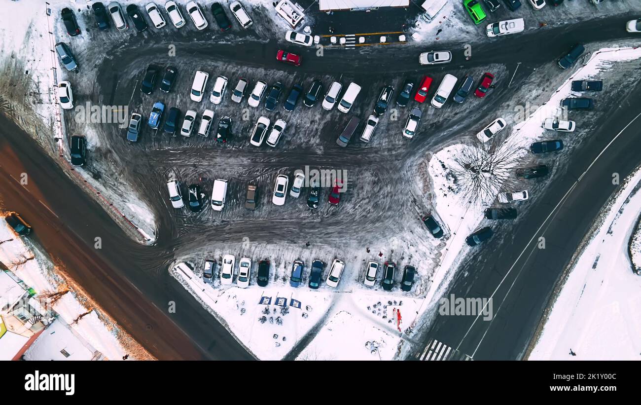 Aerial top down view of small supermarket parking lot with cars at ...