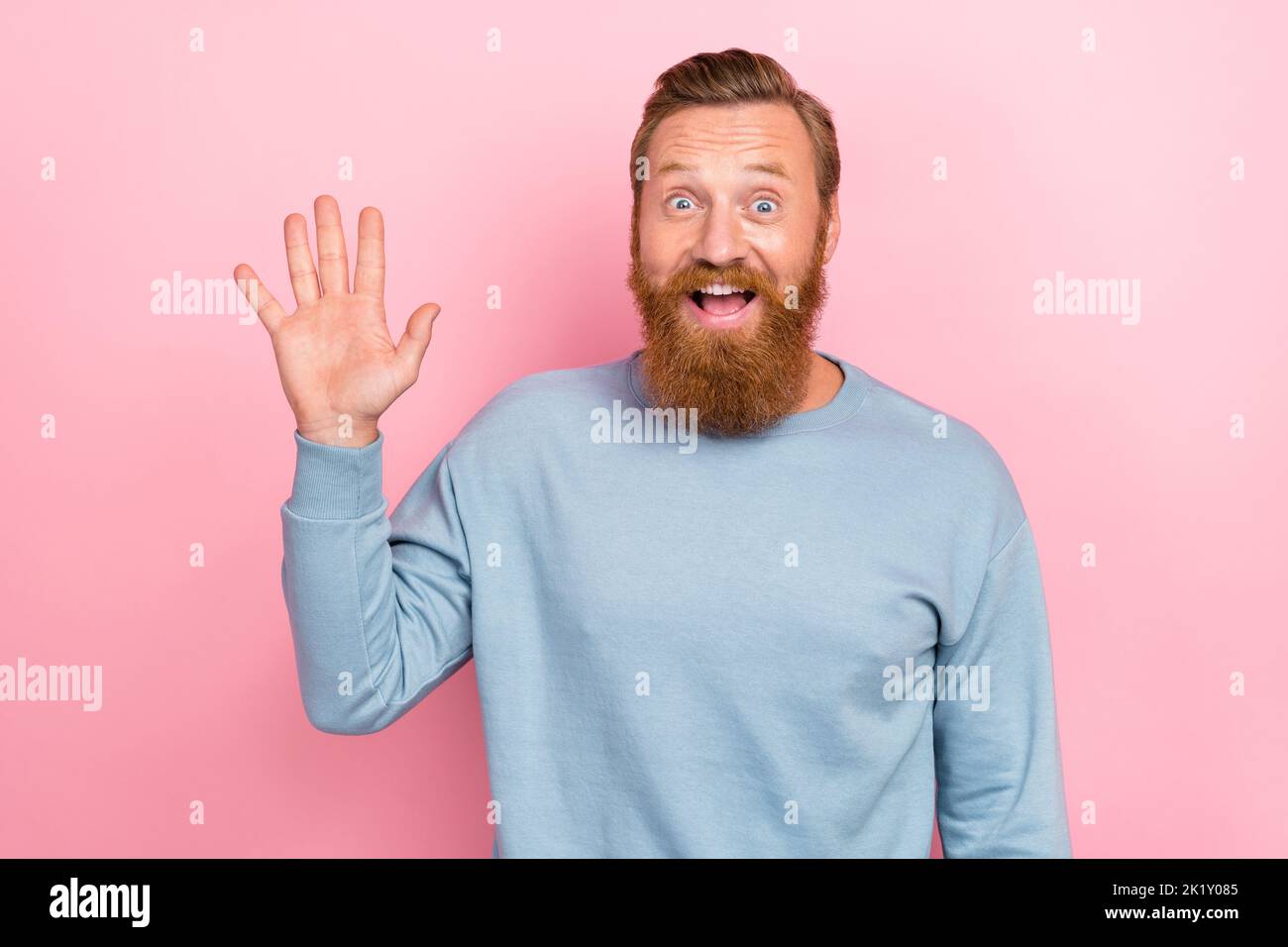 Photo of positive cheerful guy with red hairstyle dressed blue long ...