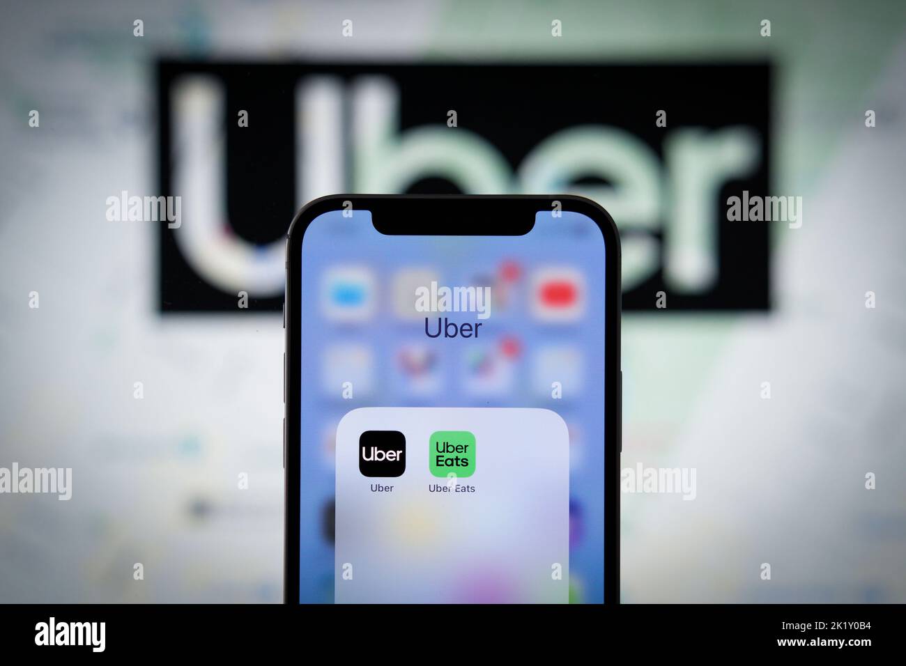 The Uber app application with a map of New York City is seen on an Apple iPhone mobile phone in ...