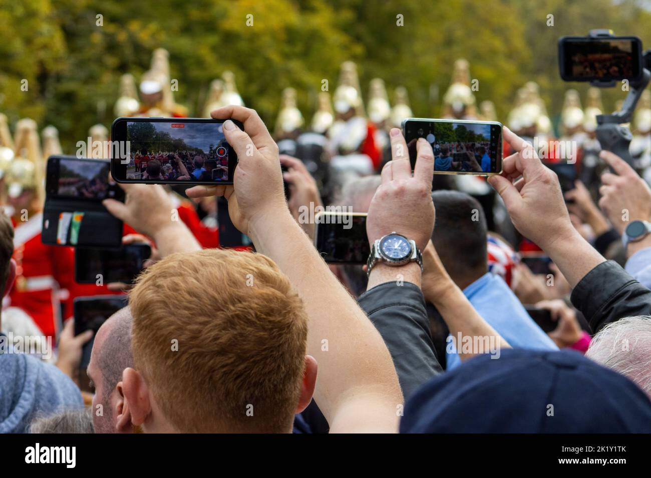 Lots of mobile phones capturing the queens state funeral procession at ...