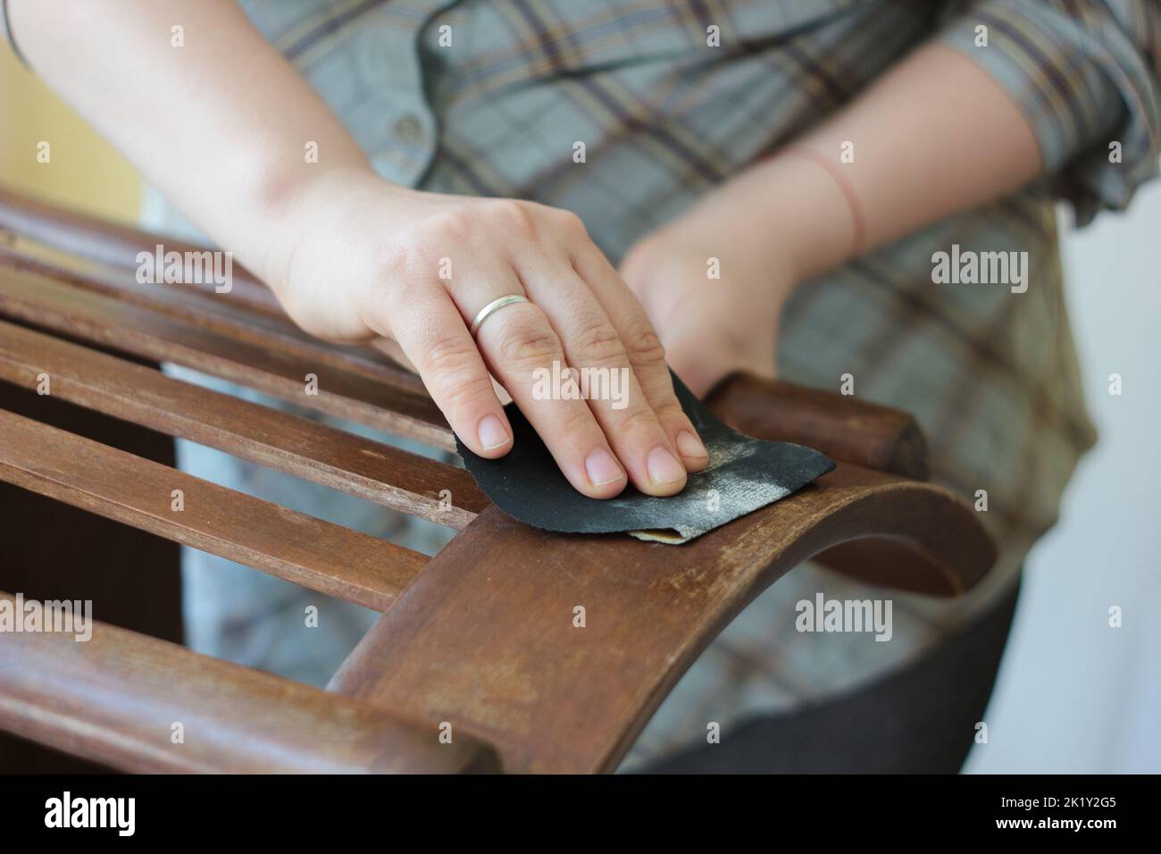 Chair repair with abrasive paper, preparing its for coloring Stock ...