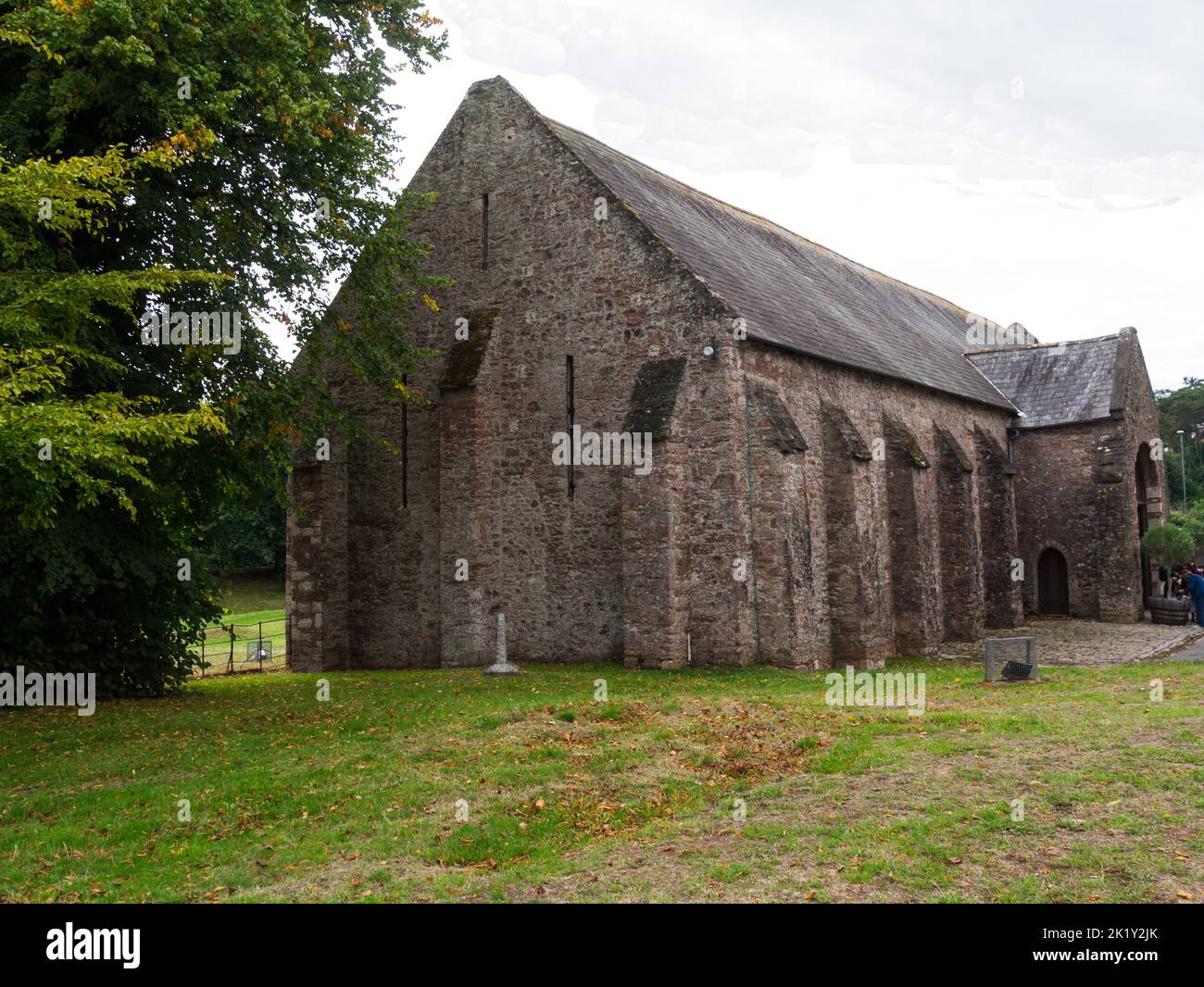 Tithe barn built along withtorre abbey early 13th century hi-res stock ...