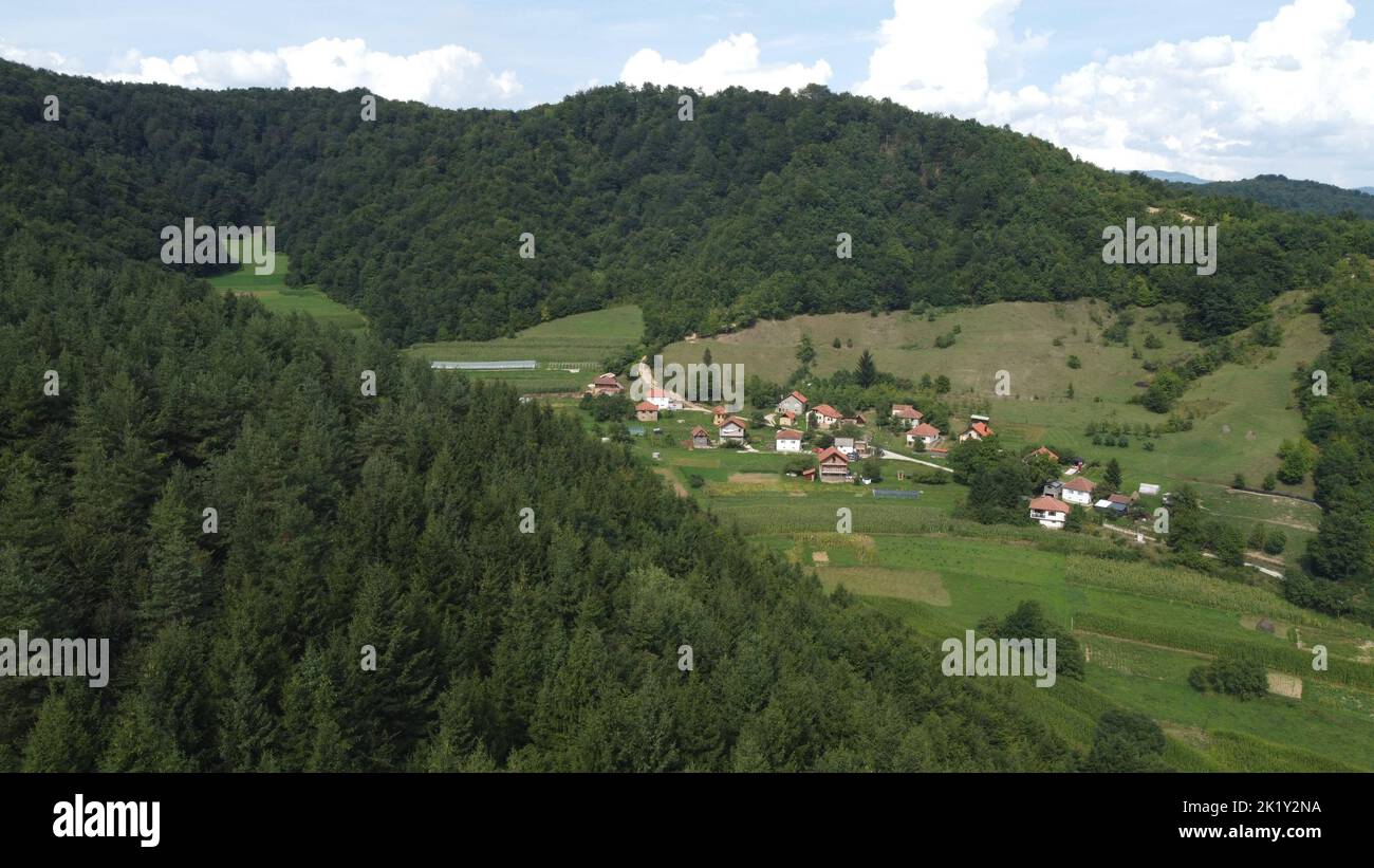 A beautiful landscape of an old Bosnian village surrounded by green ...