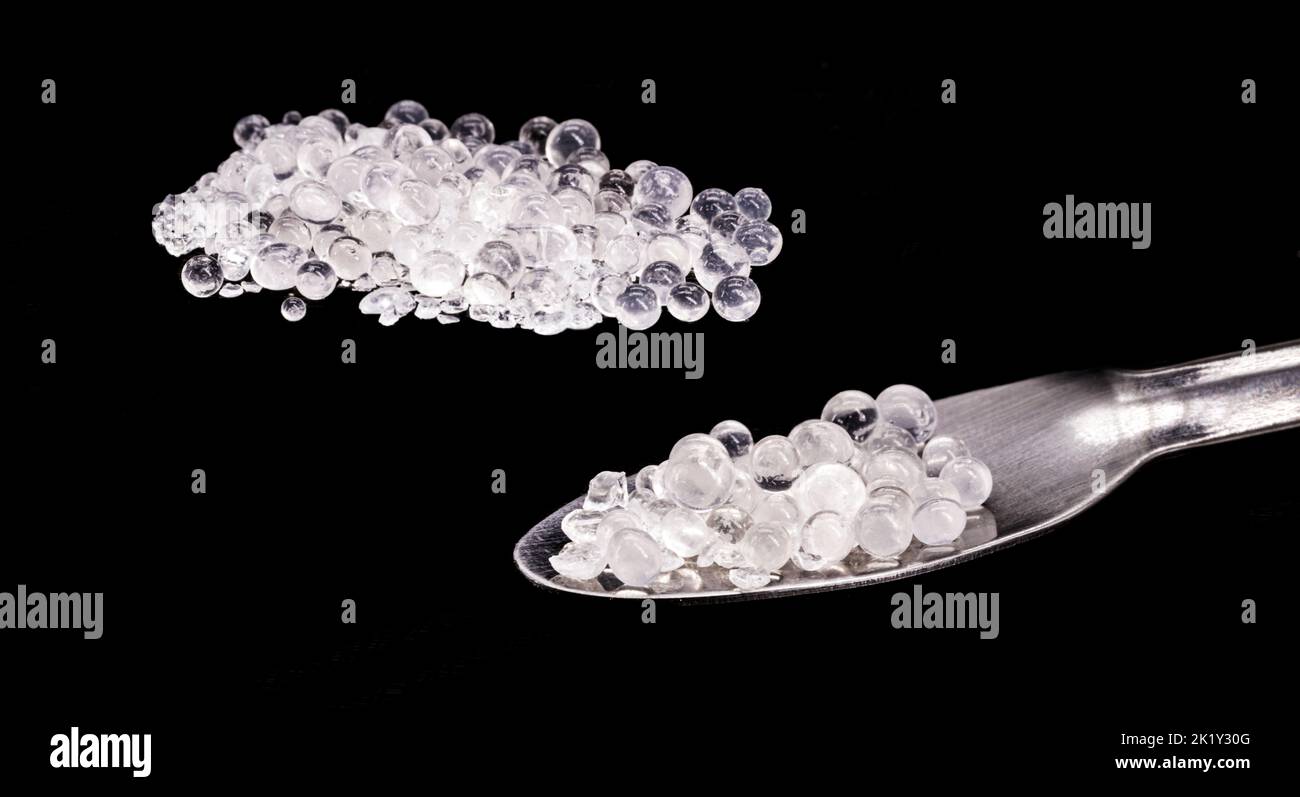 Desiccant or silica gel in white paper packaging and spread on isolated ...
