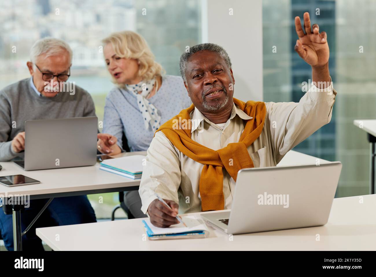 Seniors Sit In A Classroom And Talking About Project On The Laptop