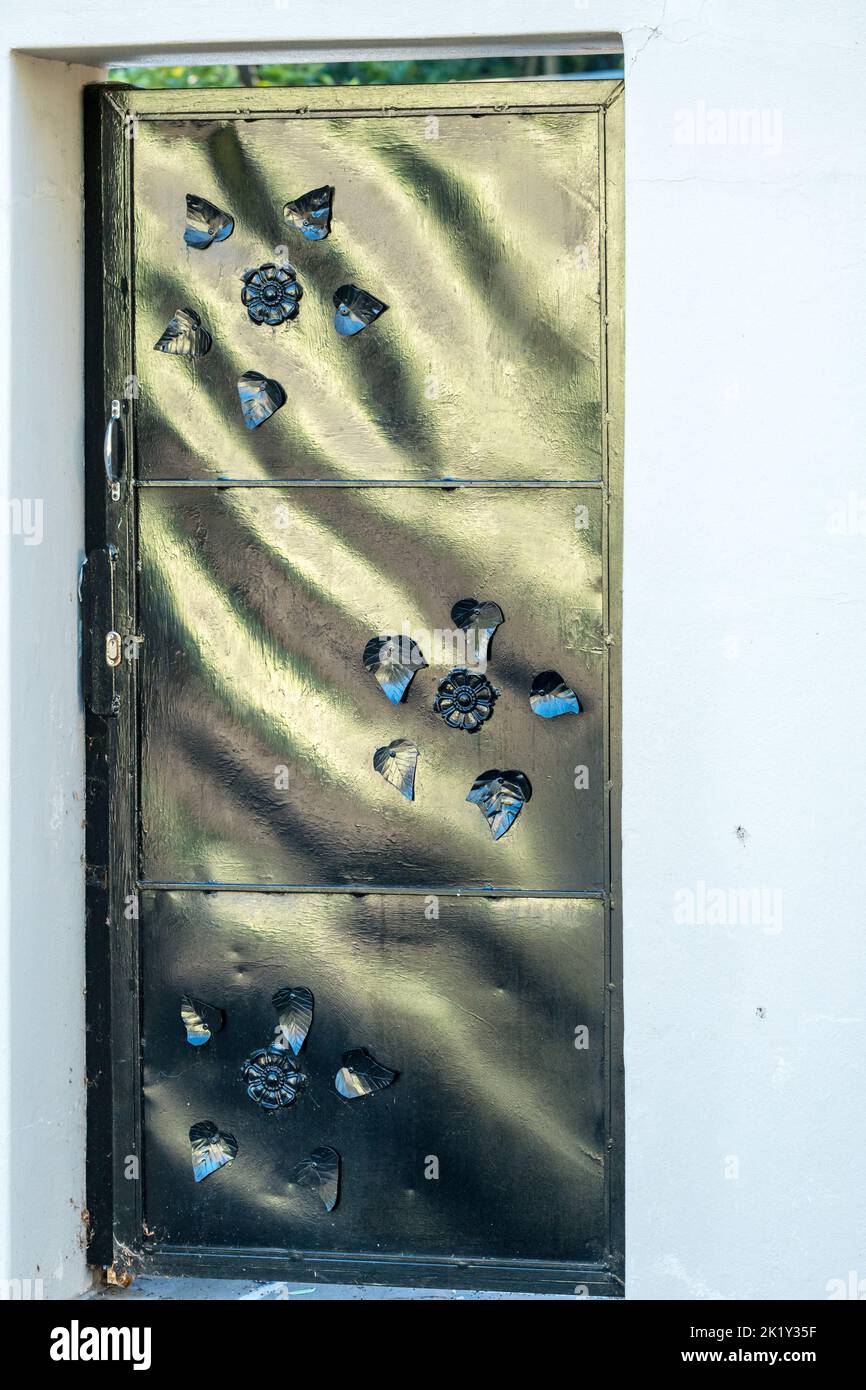 bespoke and one off decorative design black metallic door inset into a ...