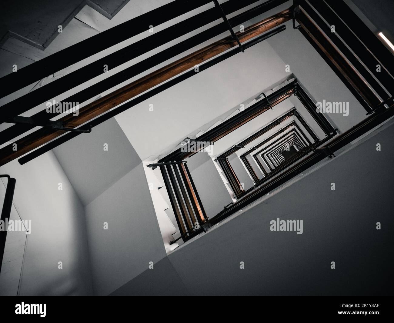 Flight of stairs going up with a spiral perspective in a building of ...