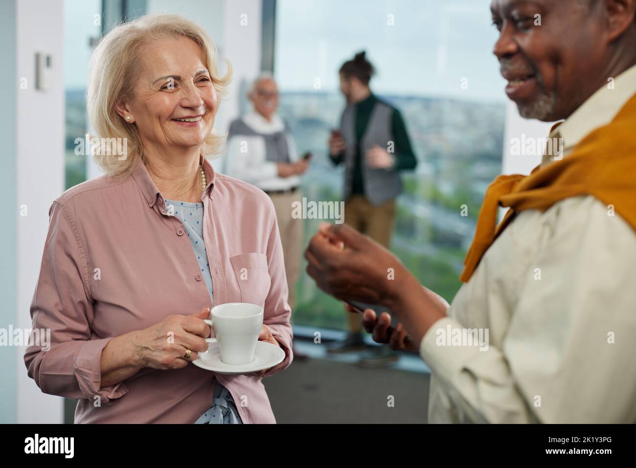 A multicultural senior students taking a break in a classroom Stock ...