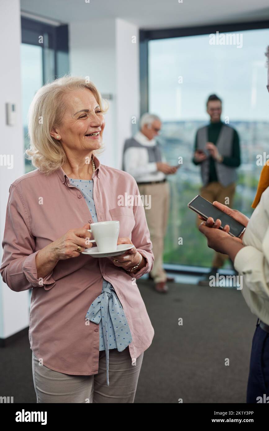 A multicultural senior students taking a break in a classroom Stock ...