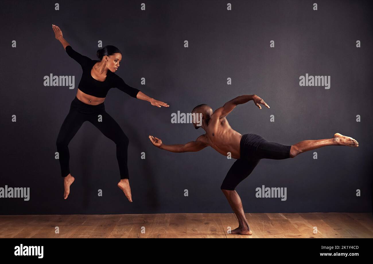 Dramatic balance of woman and man. A female and male contemporary ...