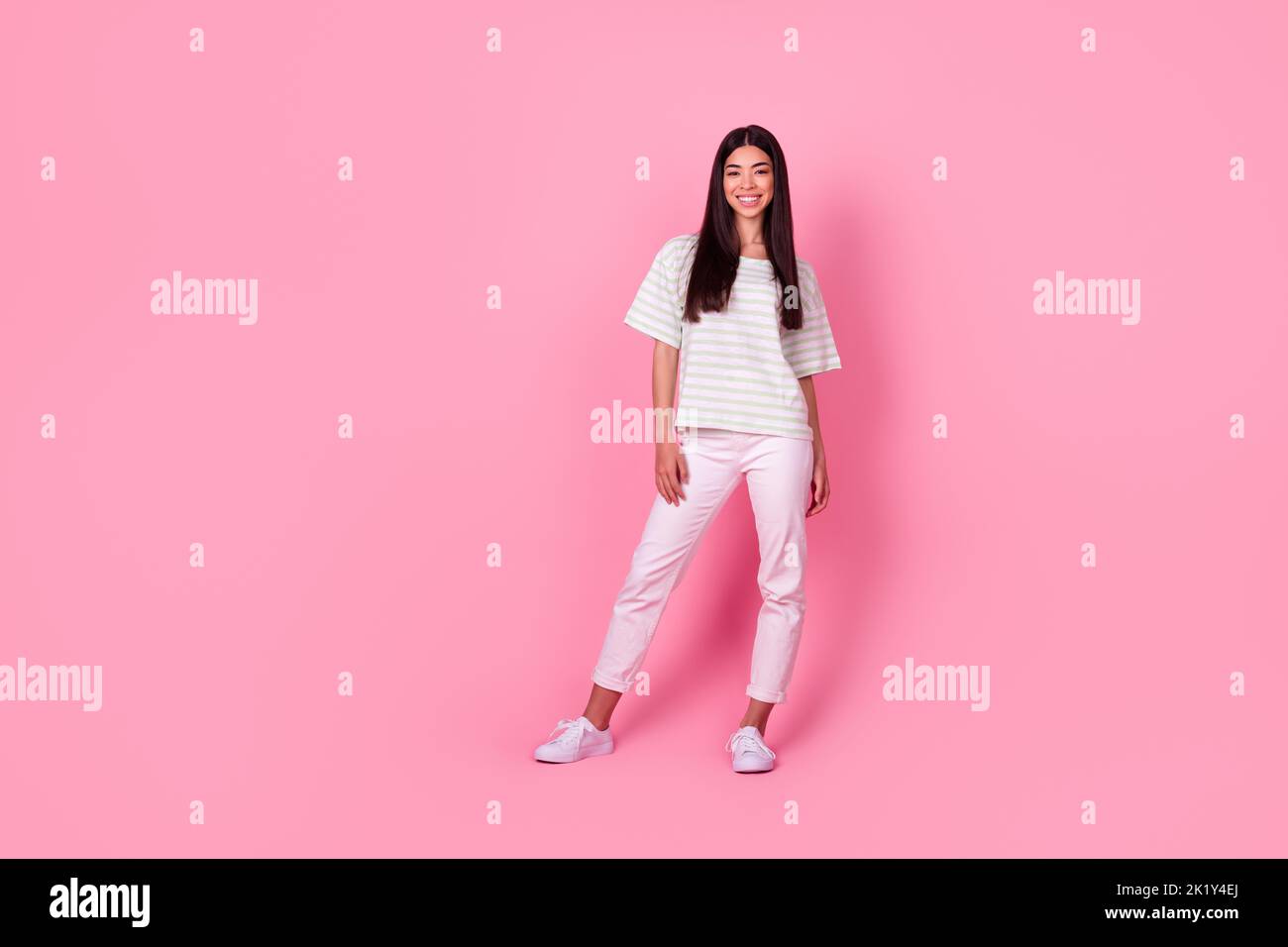 Full size photo of cheerful satisfied filipino person standing posing ...