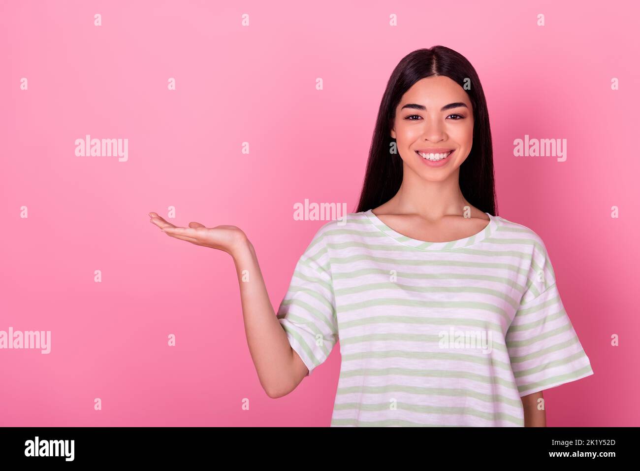 Photo of positive lady promoter hold hand demonstrate novelty advert ...