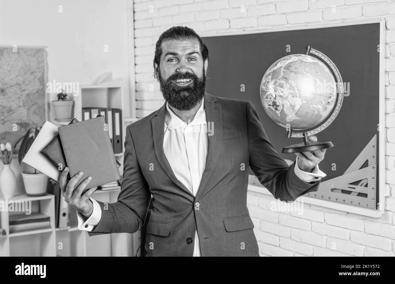 happy man with globe and books ready for lesson, school Stock Photo - Alamy