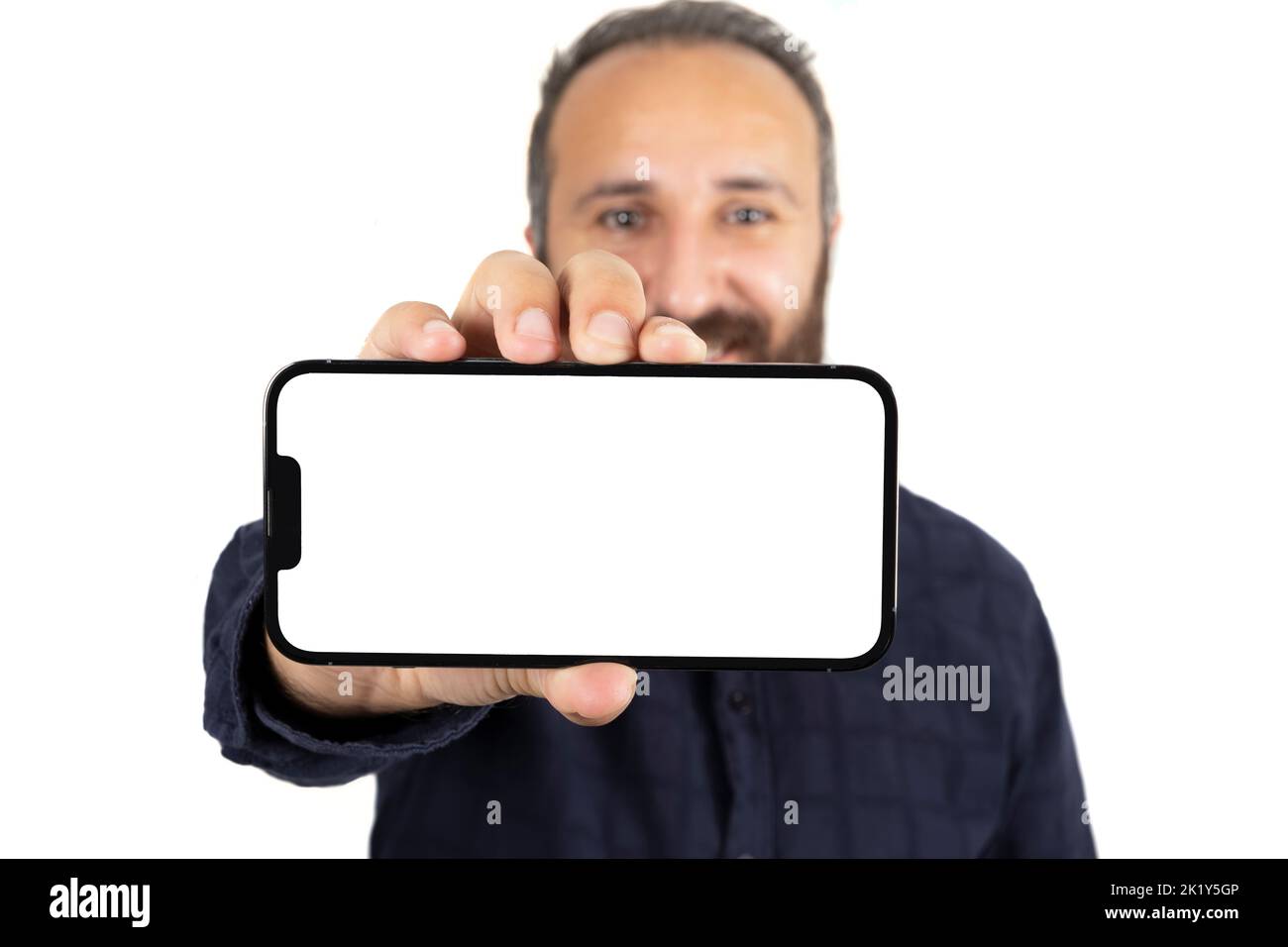 Holding smartphone, happy smiling caucasian male holding smartphone ...