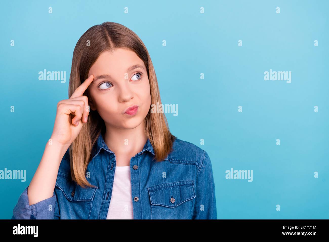 Photo of thinking teen blond girl look promo wear jeans shirt isolated ...