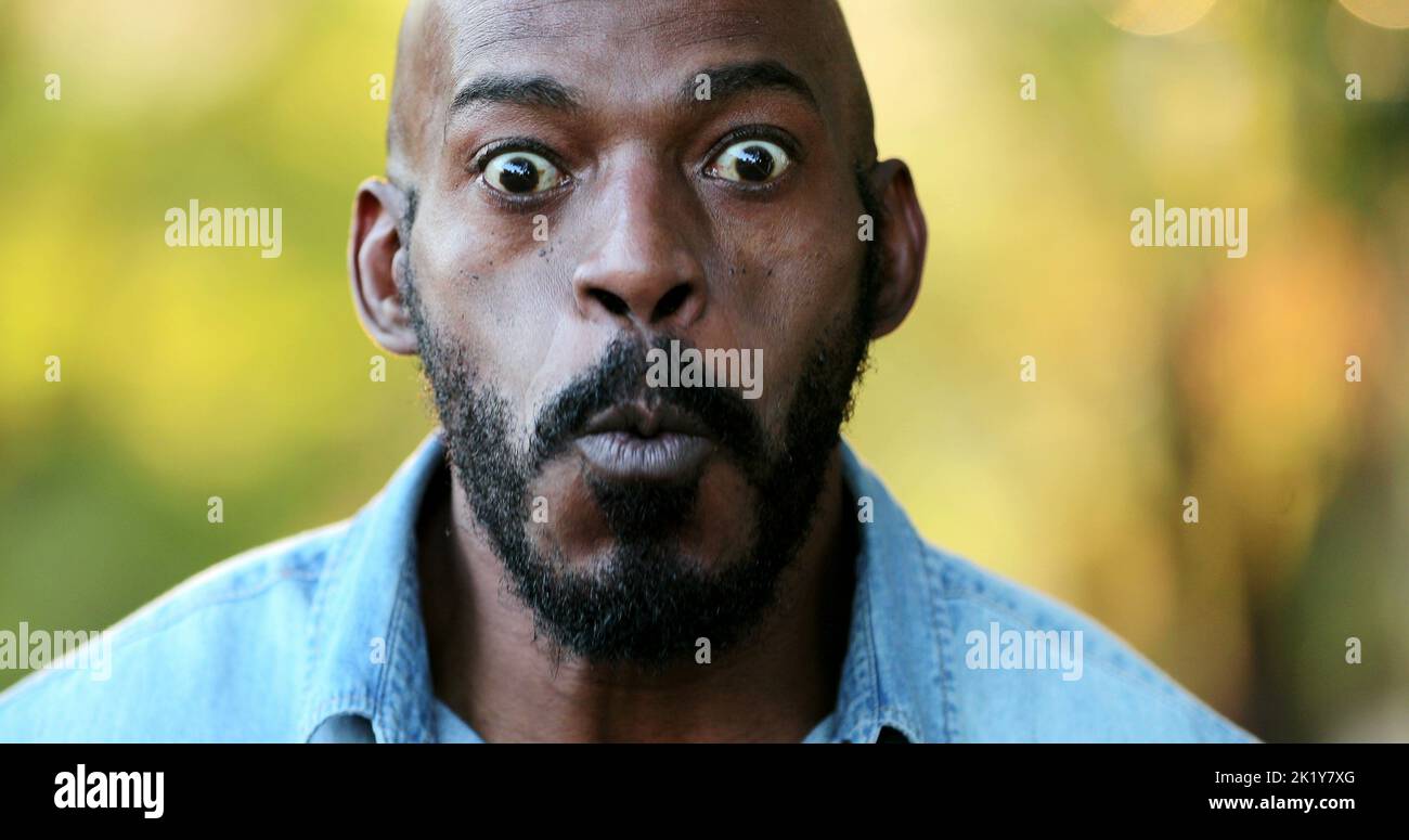 Black man surprise reaction, African guy portrait happy WOW Stock Photo ...